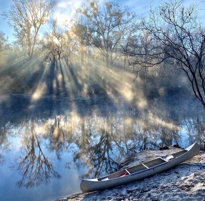 The perfect mix of steam rising off the river, campfire smoke, and ...