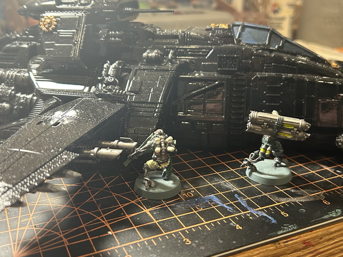 Servitors perform cleaning and maintenance rituals on an Imperial Navy ...