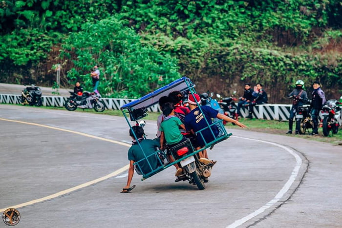 2-Wheeled Motor Cabbie (Habal-Habal) cornering at approximately 60 kph ...