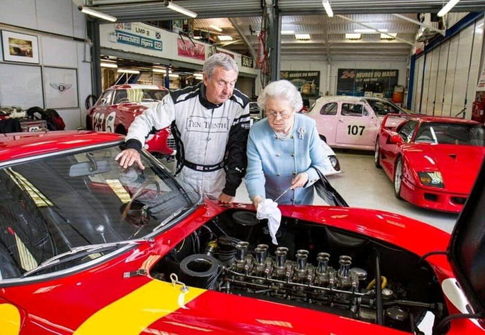 Queen Elisabeth helping Pink Floyd's drummer Nick Mason check the oil ...