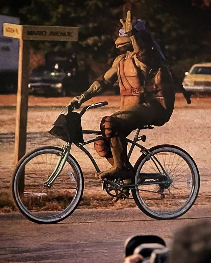 Leonardo (Mark Caso) riding a bike on the set of Teenage Mutant Ninja ...