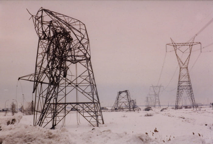 Dozens of high-voltage transmission towers crumpled by the weight of ...