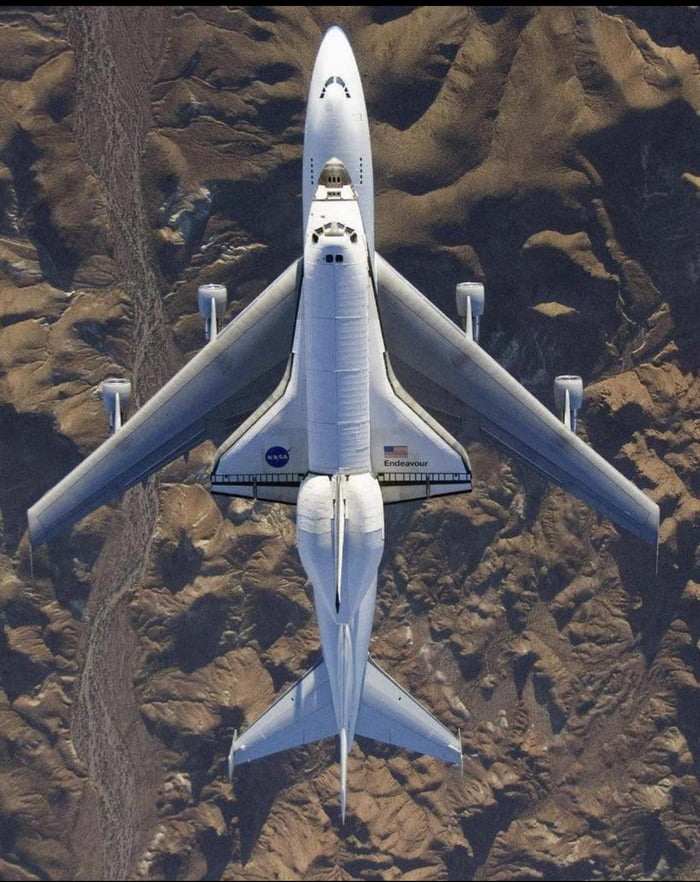 Bird's-eye view looking down on Space Shuttle Endeavour as it flies ...