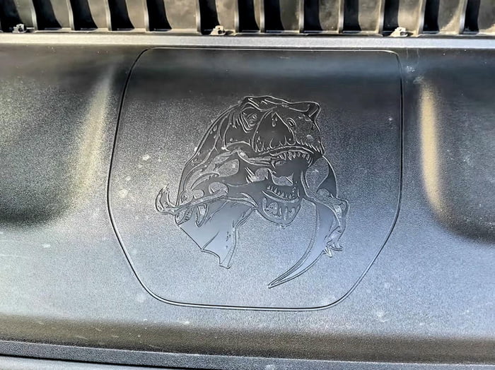 The Dodge Ram TRX has an image of a T-Rex eating a Velociraptor hidden ...