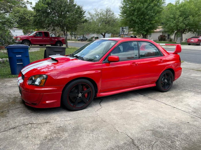 Red subaru Impreza WRX Sti with white stripes. - 9GAG