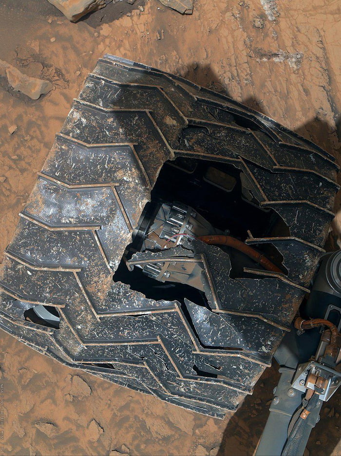 One of the Curiosity rover's wheels after over 11 years of traversing ...