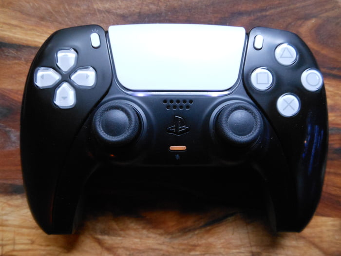 Behold my creation. Combined a black controller with buttons from the original. Cool or nah? - 9GAG