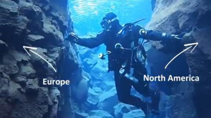 This trench in Silfra Fissure, Iceland is the only place in the world ...