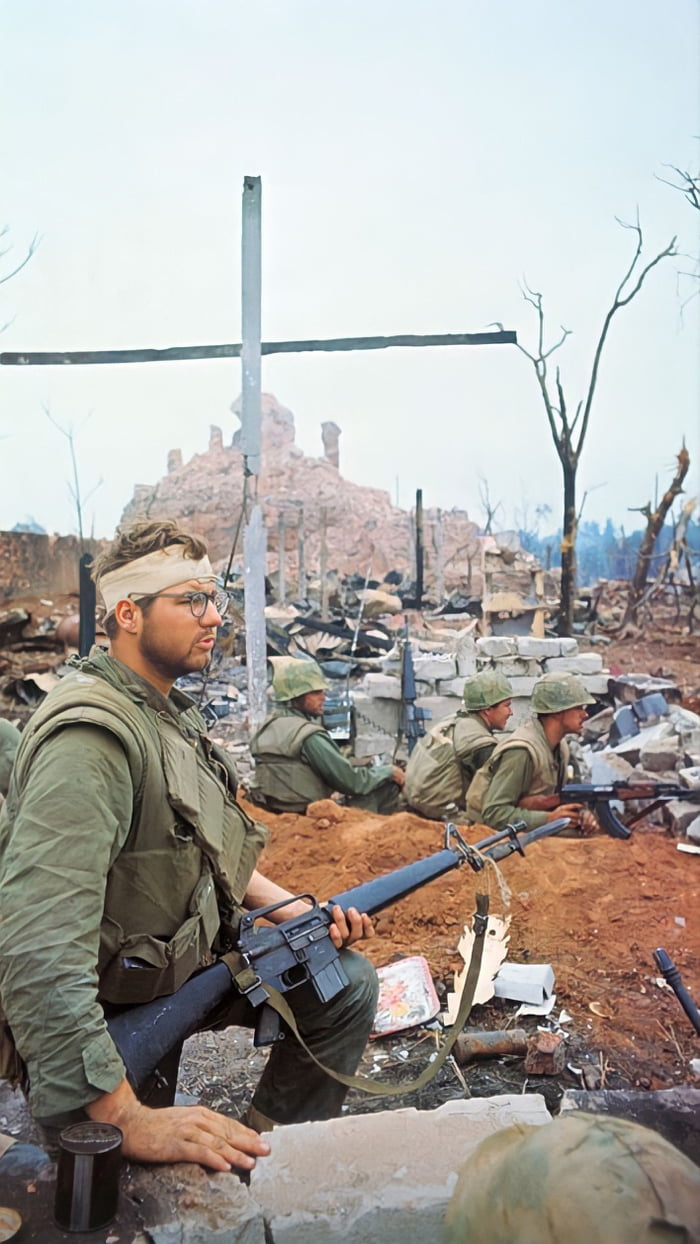 U.S. Marine watch out for the enemy as Dong Ba gate and tower, part of ...