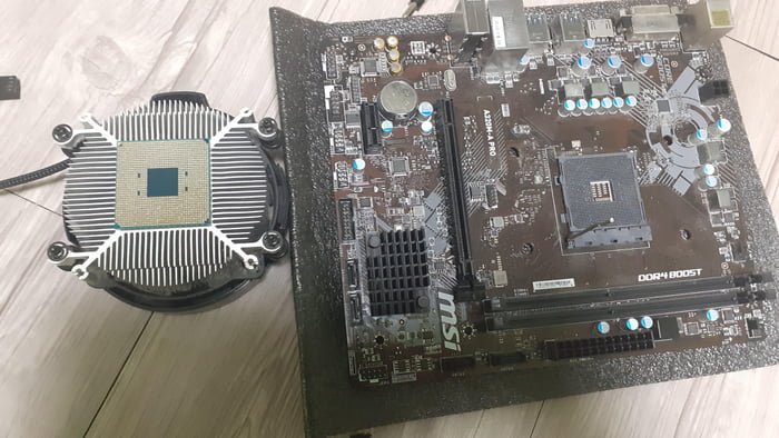 AMD CPU stuck to the CPU cooler, not sure if the cooler is crappy or ...