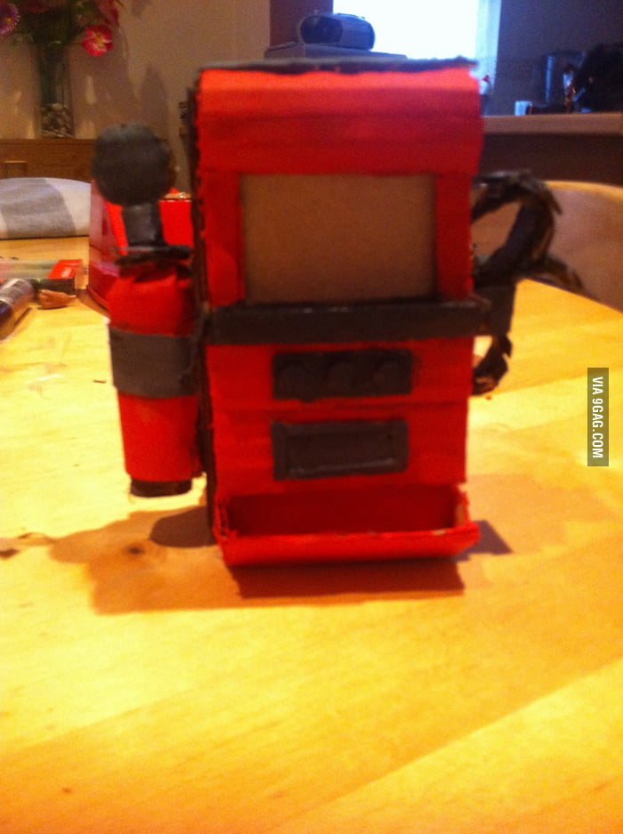 "Dispenser going up" (made from cardboard) - 9GAG