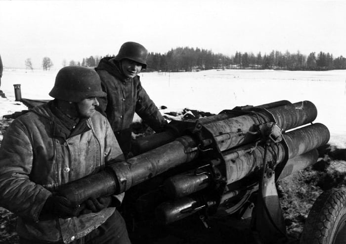 Belgium. 1945. German troops reload their 15 cm Nebelwerfer 41 multiple ...