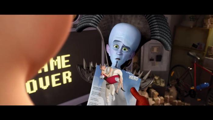 In Megamind (2010), Titan holds up a magazine, with Megamind's head ...