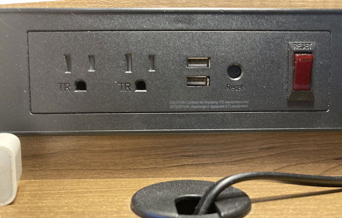 USB ports have the same spacing as AC prongs. Zap! - 9GAG