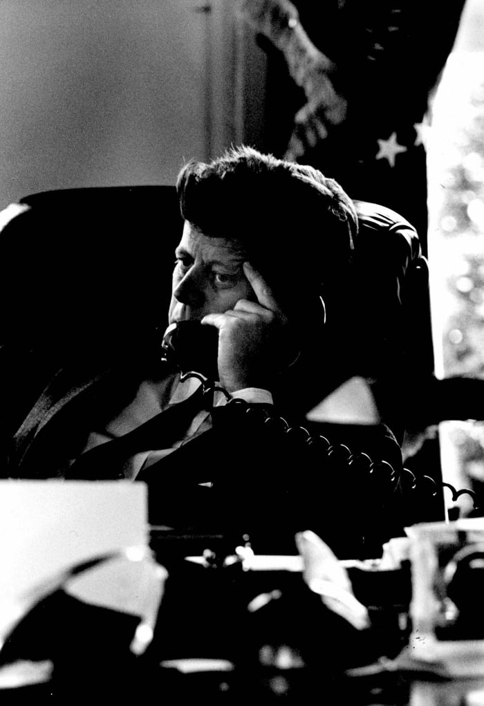 President John F. Kennedy looking serious while on telephone in the ...
