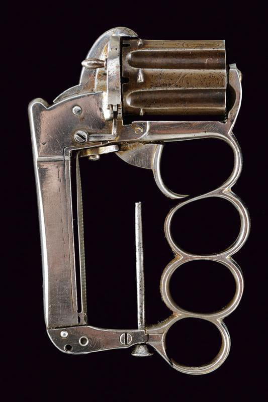 Combination brass knuckles/revolver that was made in Liege, Belgium in ...