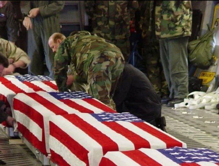 Poland, present days, coffins covered with USA flags. Did these guys ...