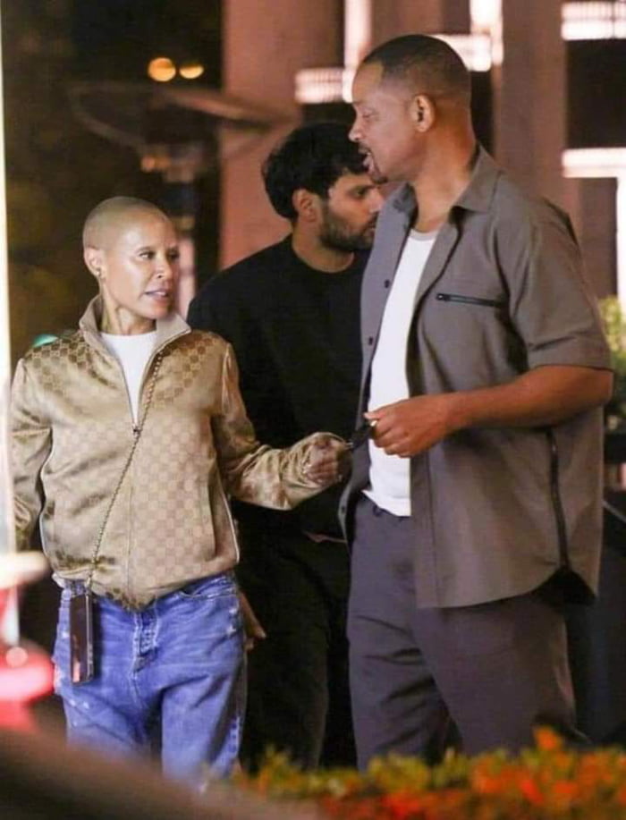 Will Smith outside with his new Tesla AI robot. - 9GAG