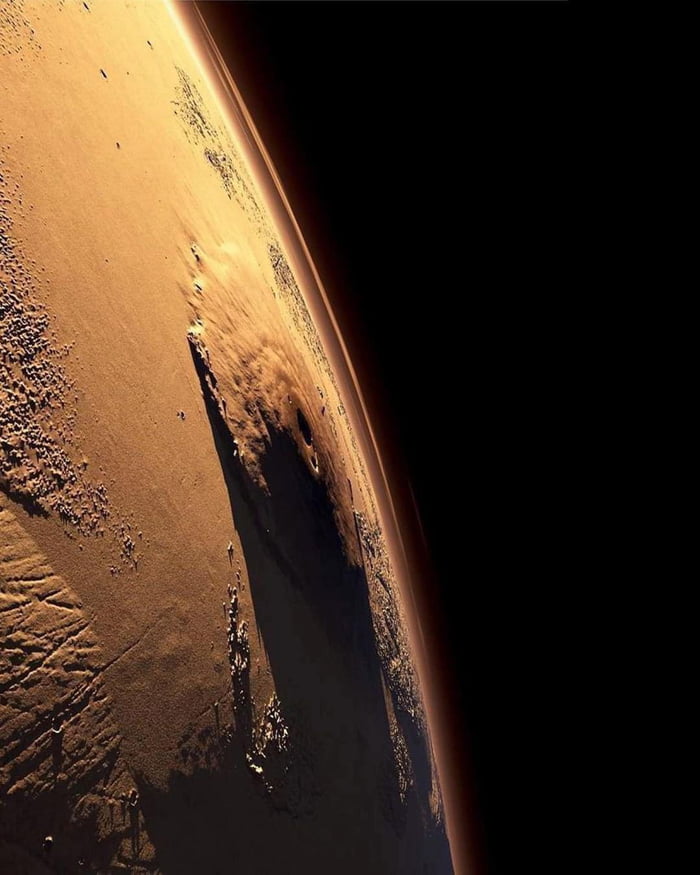 Pictured here is Olympus Mons, an enormous shield volcano on Mars, the ...